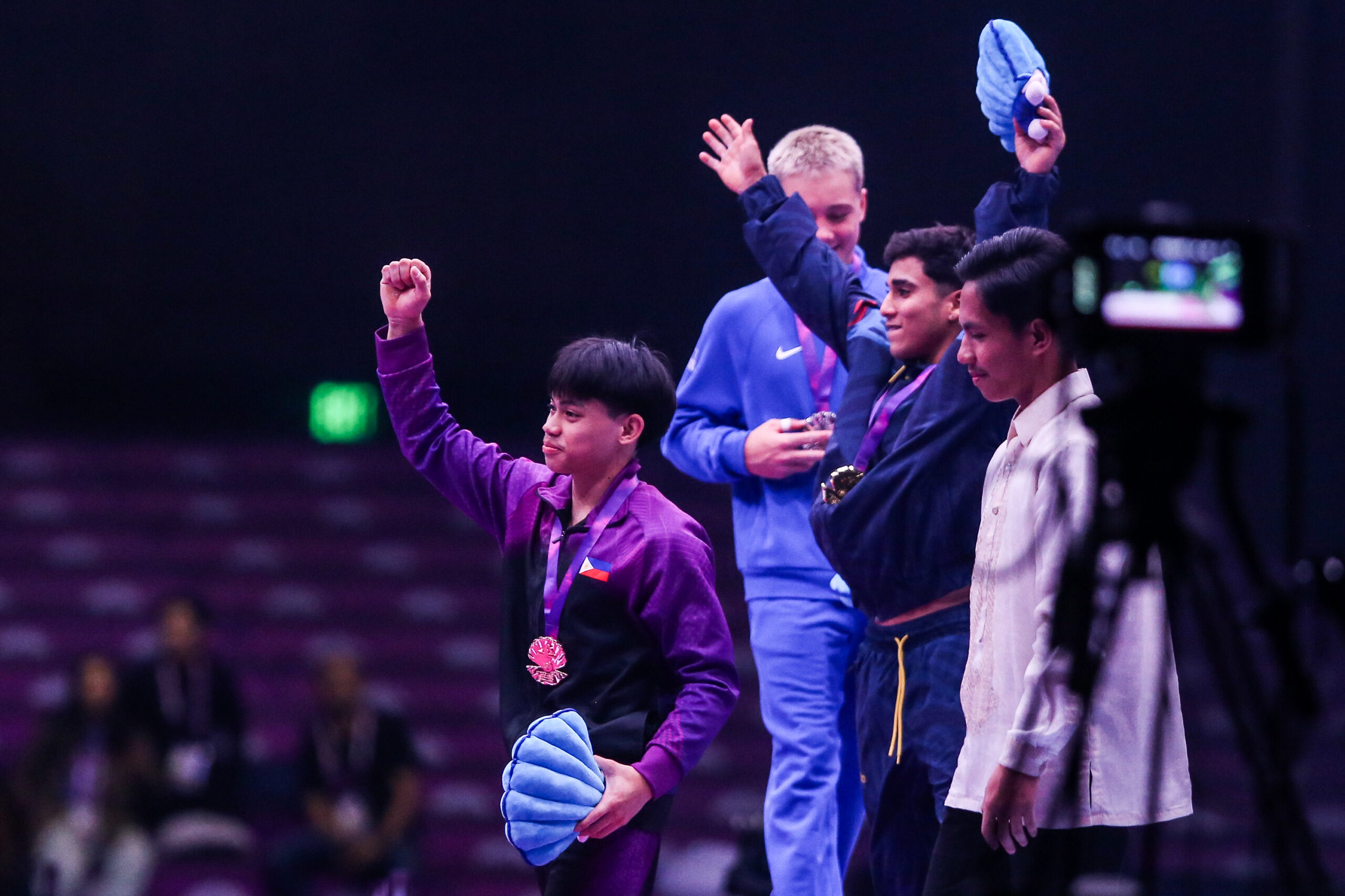 Karl Eldrew Yulo beams with pride over horizontal bar routine